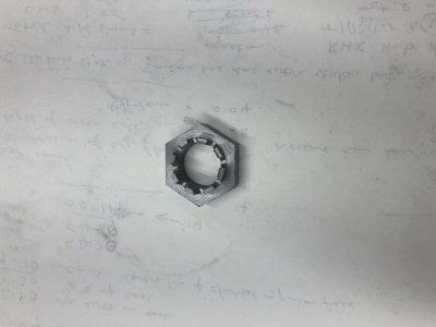 Gearbox input shaft, bevel gear shaft and output hub bearing securing nuts.