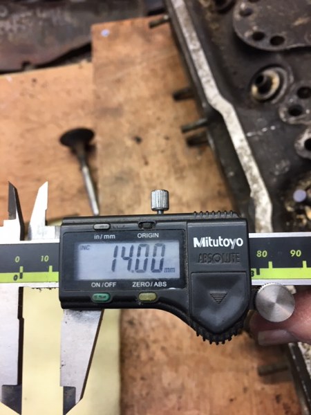 Dismantle the tooling and measure the valve guide protrusion into the ...